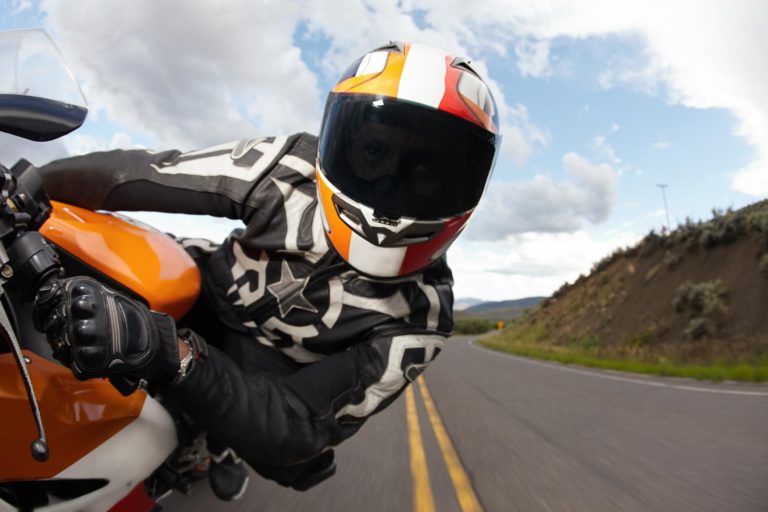 sport-bike-motorcyclist-lean-in-open-road-speeding | Rands Adventure Gear